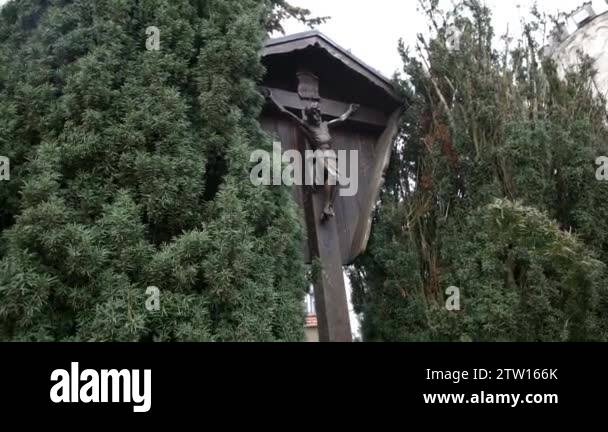 Wooden landmark with Christ crucified on cross. Art. View of wooden ...