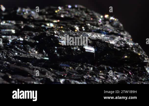 CLOSE UP BOKEH: Shimmering dark Hematite with a metallic surface ...