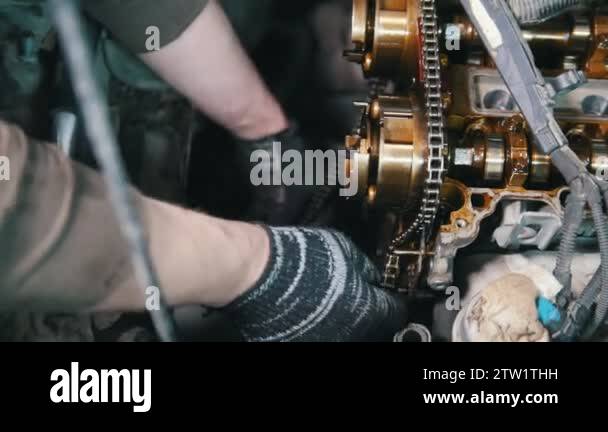 Mechanic dismantles the engine of a car, car repair, disassembly of the ...