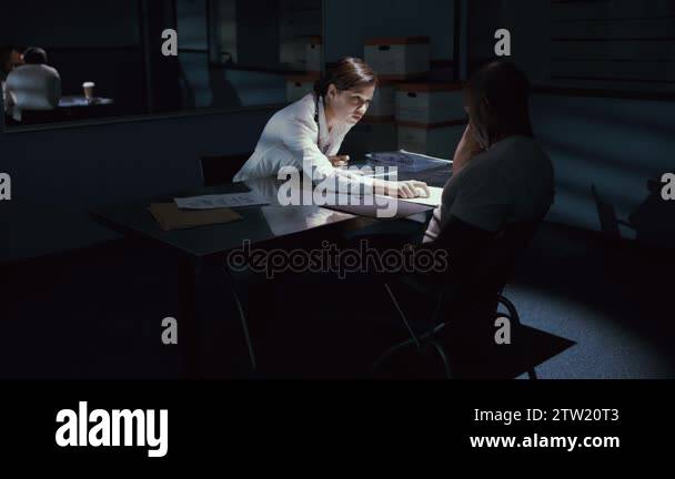 4K Female police detective questioning a crime suspect in interrogation ...