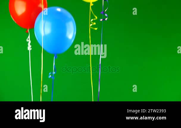 Flying balloons on green screen Stock Video Footage - Alamy