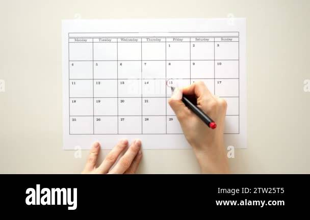 Sign the day in the calendar with a pen, draw a birthday Stock Video ...