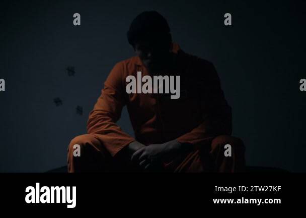 Poor light blinking in prison, convicted male sitting in cell, riot ...