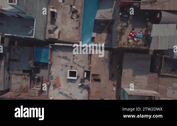 A happy child greets you, the take-off of a drone over a block of slums ...