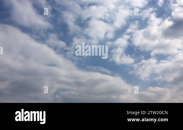 White clouds disappear in the hot sun on blue sky. Loop features time ...