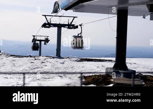Ski resort lift cabin, climb and descent cabins on the hillside with ...