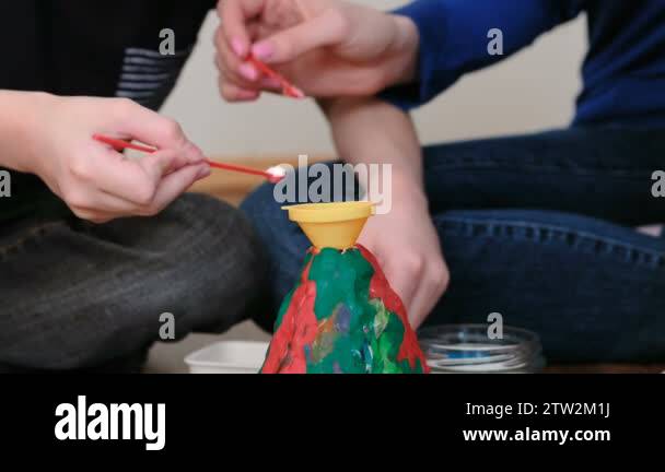 Closeup of the hands of mom and son applied the chemicals into the ...