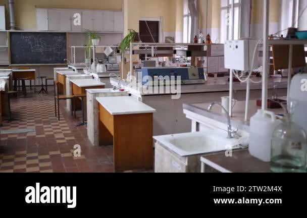 Light switch in empty chemical laboratory with many tables Stock Video ...