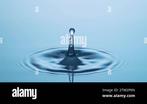Drop of Water Impact on a Water Surface in Slow Motion - High Speed ...