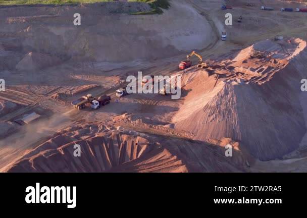 Extraction of construction sand at the quarry. Loading construction ...