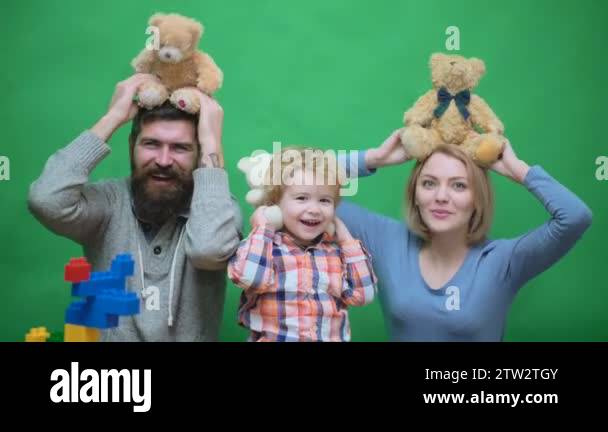 Young family play game with construction plastic blocks. Family games ...