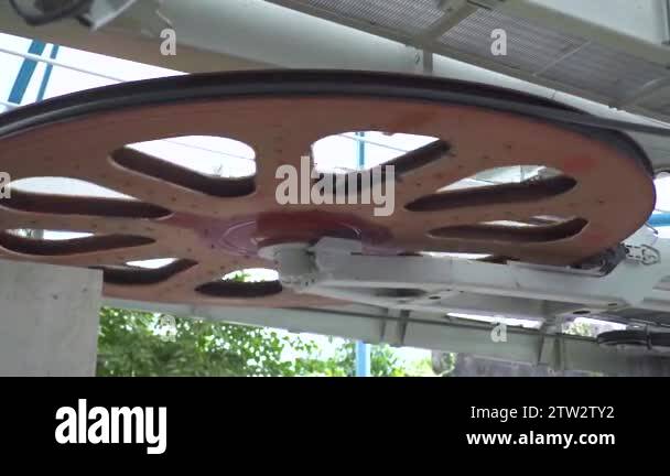 Cable car on rope way for passengers transportation. Close up rollers ...