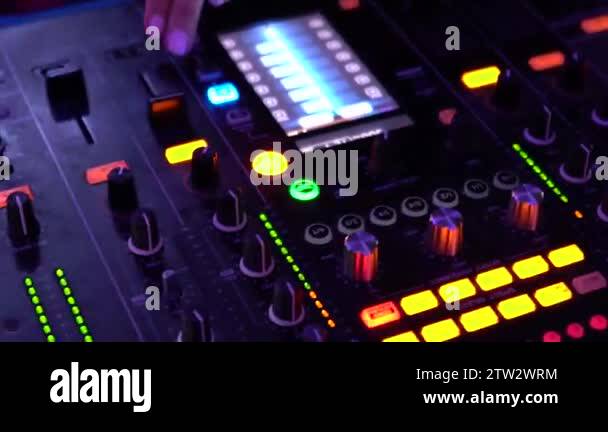 Girl DJ presses a button on the music installation in a nightclub Stock ...