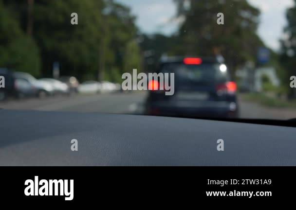 Blurred view through the front window of the car. The car goes on a ...