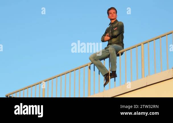 Man sitting on fence Stock Videos & Footage - HD and 4K Video Clips - Alamy