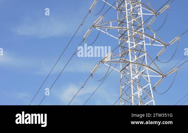 Electricity tower in high or medium voltage tower with clouds in the ...