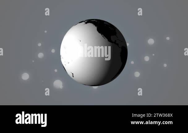 Digitally generated rotating globe in black and white while orbs and circles surrounds it Stock ...