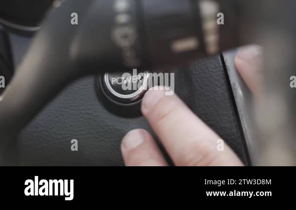 Starting car engine. Finger press the button to start the car engine ...