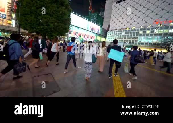 People cross the famous intersection in Shibuya, Tokyo, Japan Stock ...