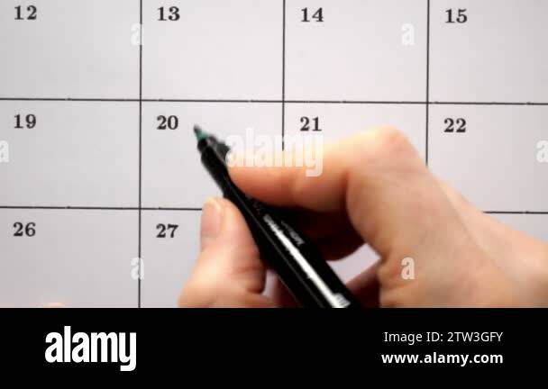 Sign the day in the calendar with a pen, draw a good bad day Stock ...