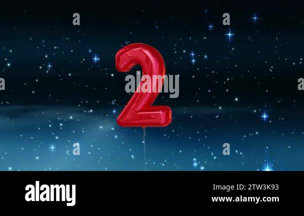 Digital animation of a red number two shaped balloon with a starry sky ...