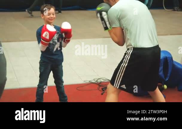 Moscow, Russia - April 12, 2019: Cute boy training with coach and in ...