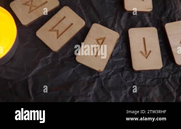 Wooden rune wheel. runic layout and candles, 4k, slow-motion shooting ...