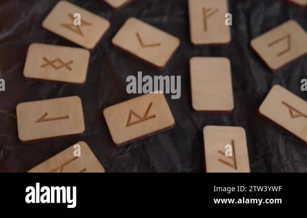 Wooden rune wheel. runic layout and candles, 4k, slow-motion shooting ...