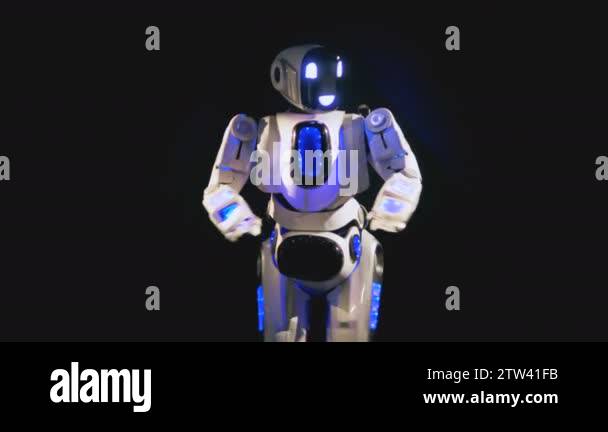Shiny robot happily dances, using its arms and legs. 4K Stock Video ...