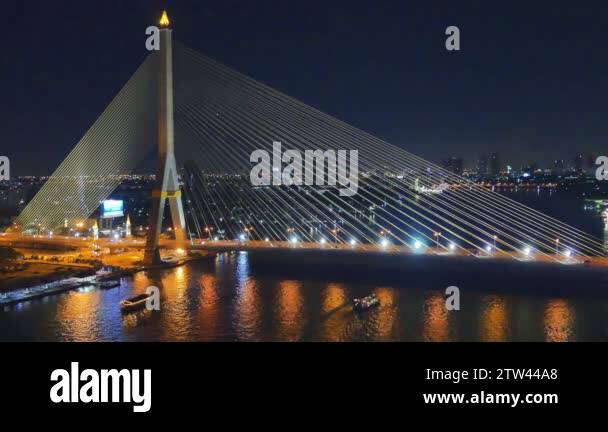 tourist boats in Chao Phraya river pass under Praram eight bridge at ...