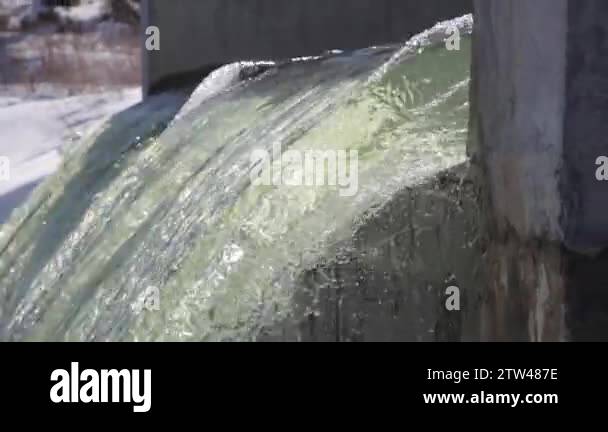 Spillway from the pipe, the dam on the river. Environmental problems of ...