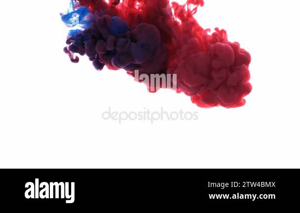 Color paint drops in water in slow motion. Ink swirling underwater ...