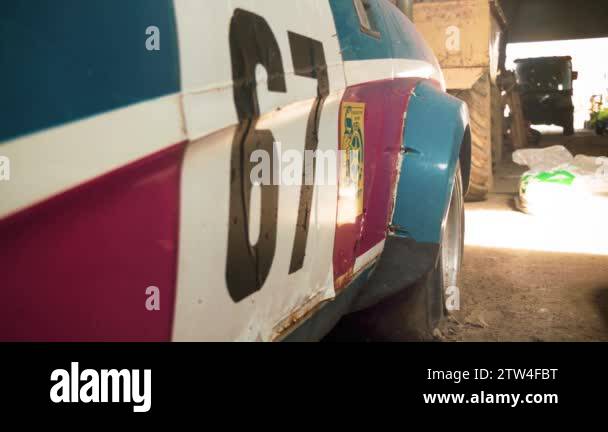 Abandoned and rusting rally car in a derelict garage Stock Video ...
