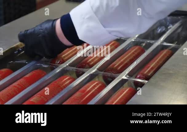 Vacuum Packaging of Processed Meat. Meat industry. Food packaging ...