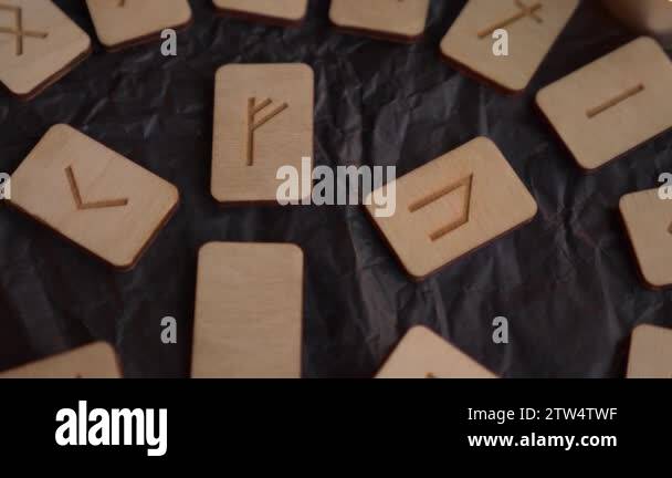 Wooden rune wheel. runic layout and candles, 4k, slow-motion shooting ...