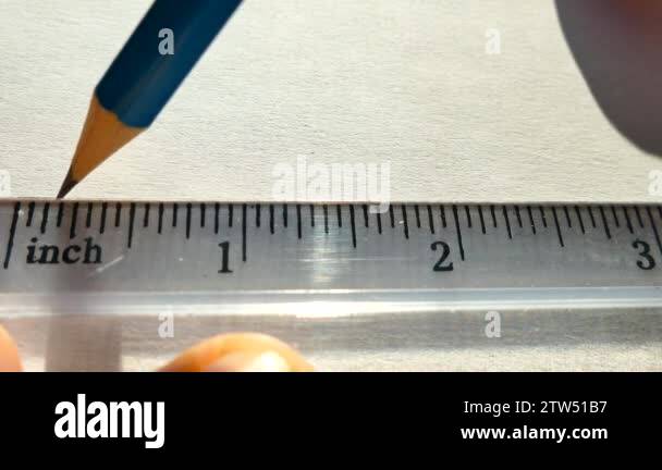 Draw a line in pencil under the ruler. Ruler with inches close-up ...