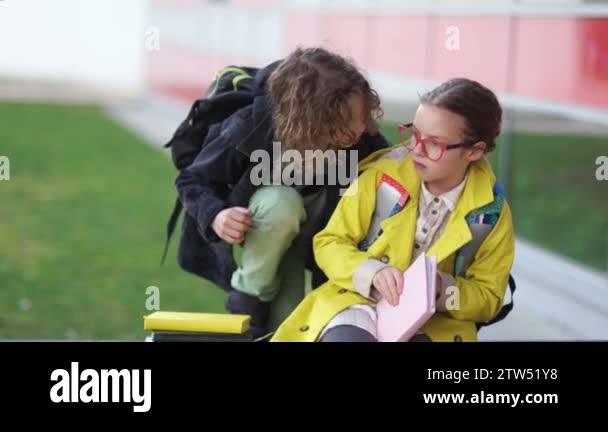 A group of teenagers humiliate a defenseless girl with glasses ...