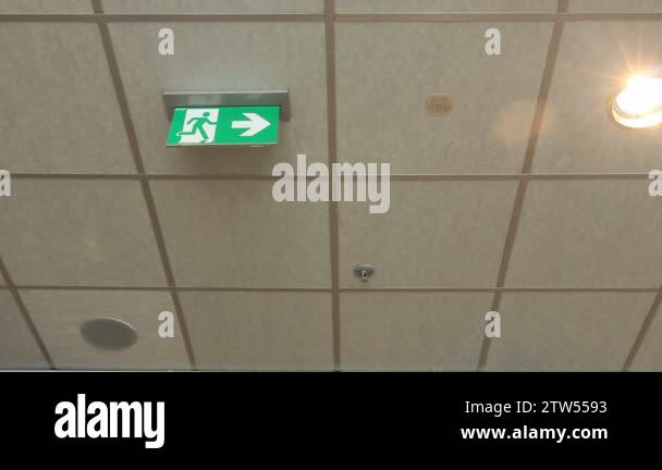 Green emergency, fire exit sign.Standard international symbol safe exit ...