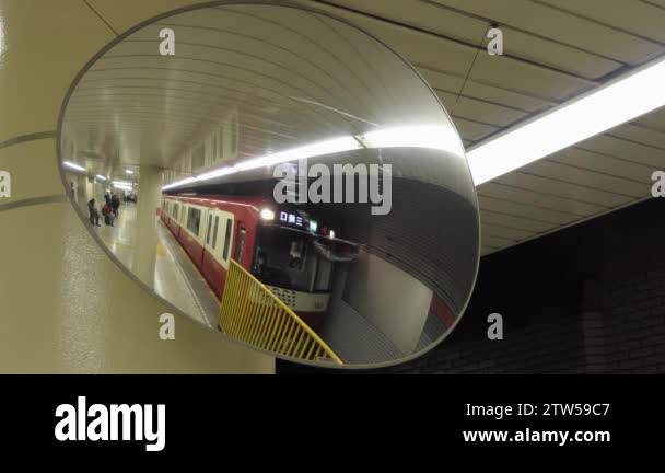 TOKYO, JAPAN - MARCH 2018 - Mirror reflecting an underground train ...