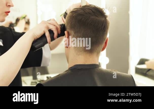 Hairdresser doing hairstyle cut Stock Videos & Footage - HD and 4K ...