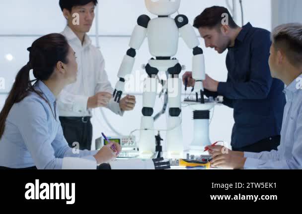 4K Technical design team collaborating on construction of robot in ...