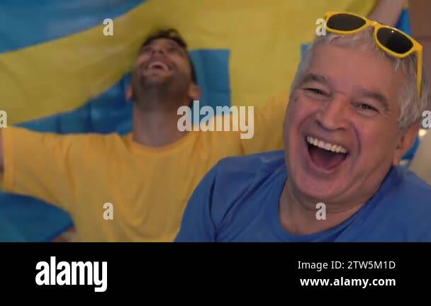 Swedish Father and Son Fans Watching and Celebrating a Soccer Game ...