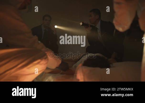 4K Police detectives and forensics team investigating dead body at a ...