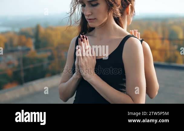 Young girls doing yoga pise namaste closeup, pranamasana. Starting ...