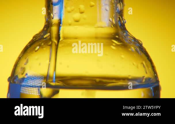 Modern volumetric flask in a medical laboratory is poured with clean ...