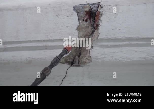 Process of cleaning crack in wall off dust by using pipe with spray ...