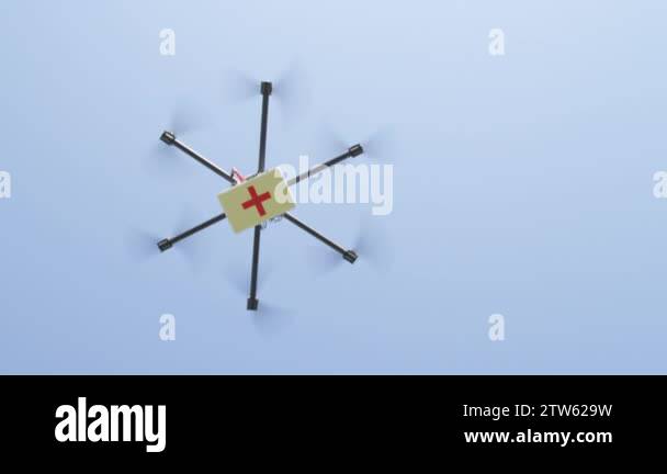 CLOSE UP LENS FLARE UAV Drone delivery. Multicopter rising and flying ...