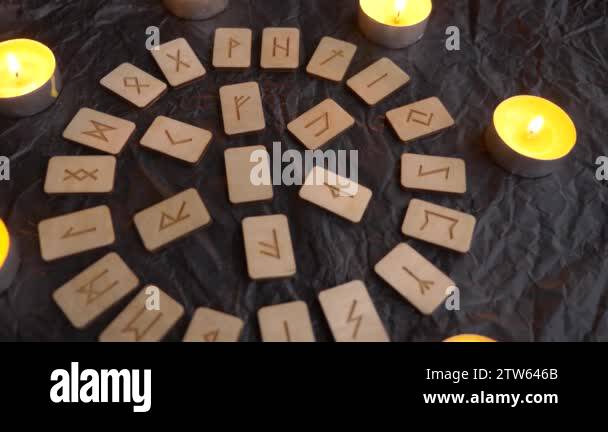 Wooden rune wheel. runic layout and candles, 4k, slow-motion shooting ...