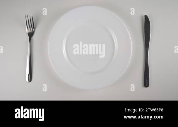 Mens hands puts washing powder pods on a plate from tureen. Preparing ...