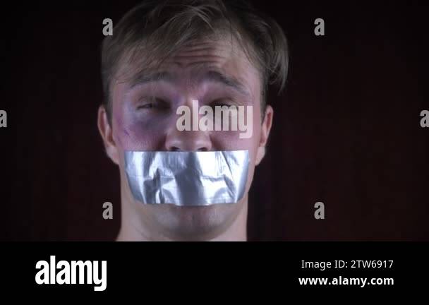 violence, crime, kidnapping and people concept - criminal tying man ...